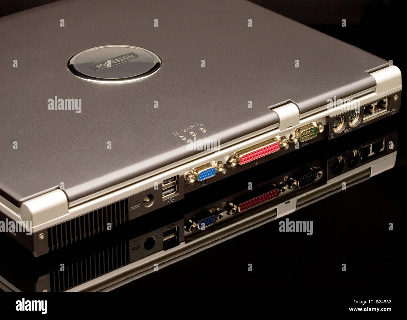 Back of computer laptop with reflection on black background Stock Photo ...