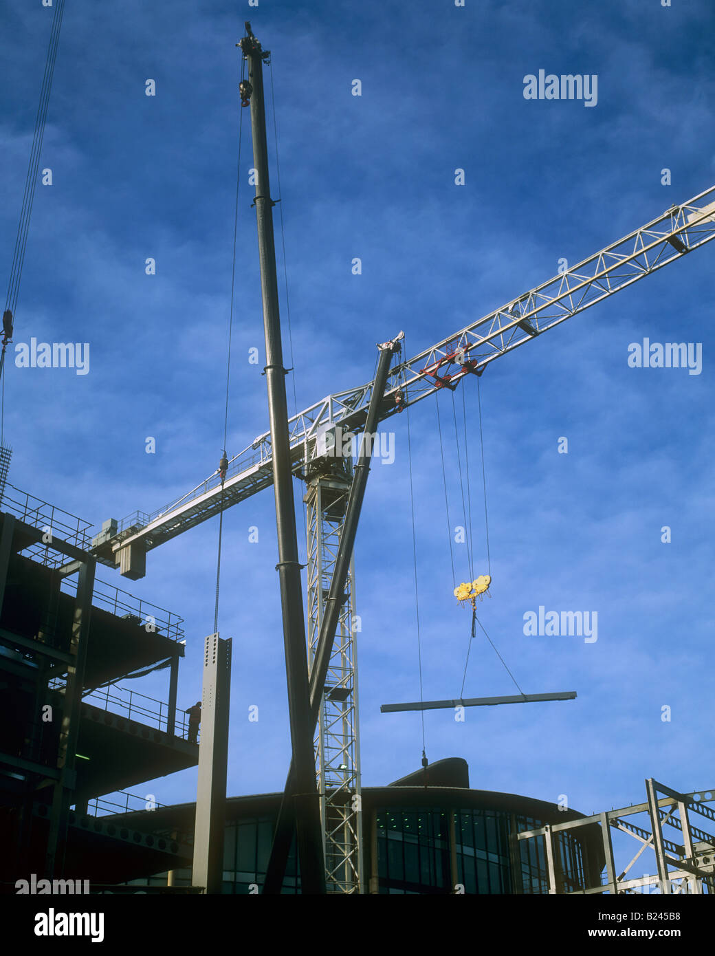 Scaffolding and crane on a construction site hi-res stock photography ...