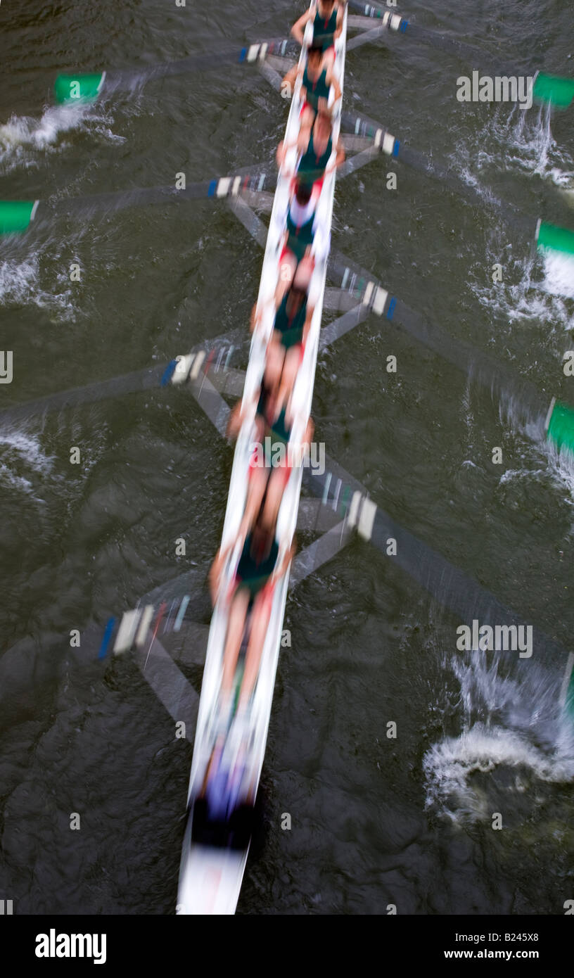 Blurred action overhead shot of an Oxford eight rowing on the Thames ...