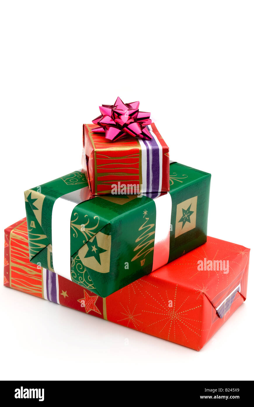 Pile of christmas presents on white background Stock Photo - Alamy