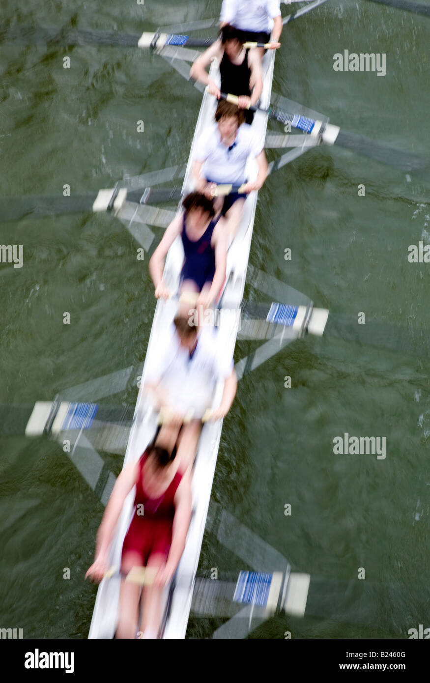 Blurred action overhead shot of an Oxford eight rowing on the Thames ...