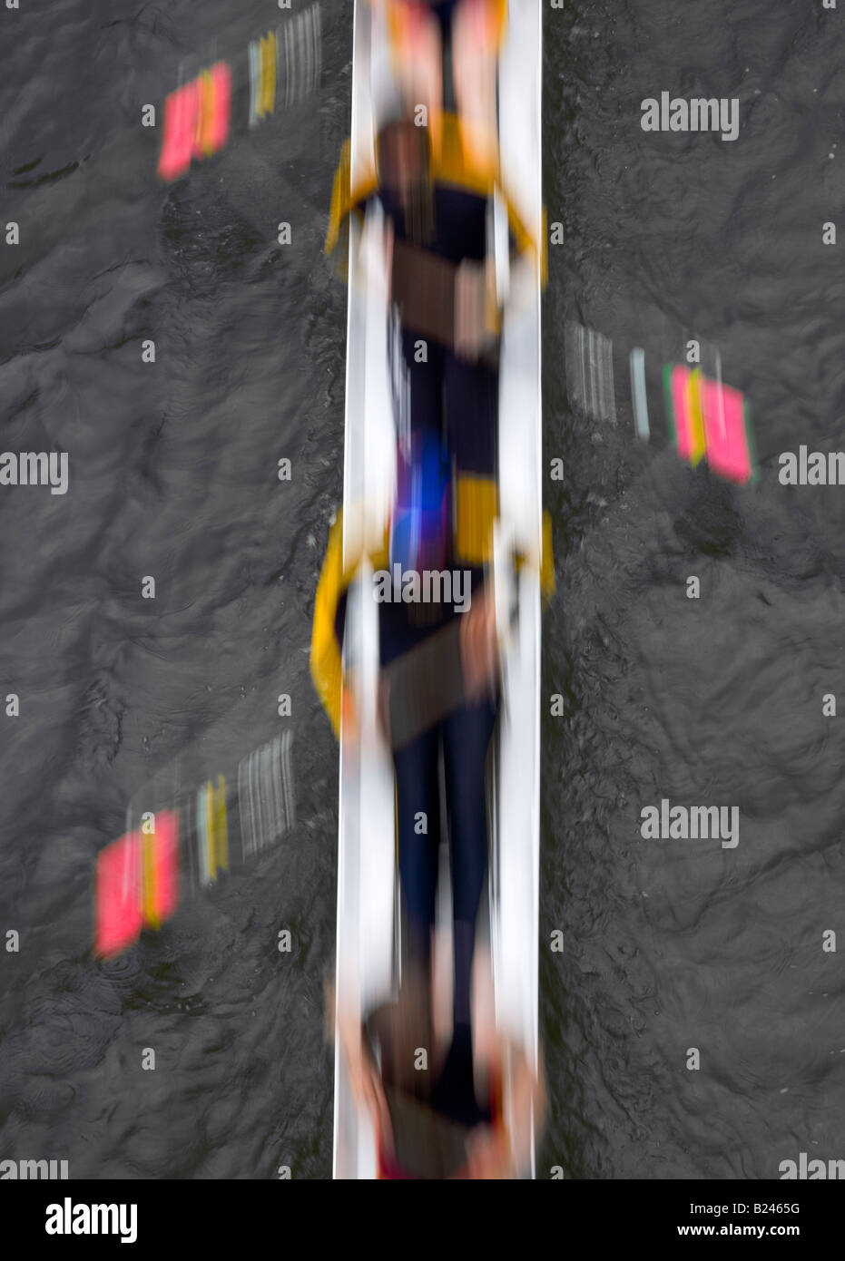 Blurred action overhead shot of an Oxford eight rowing on the Thames ...