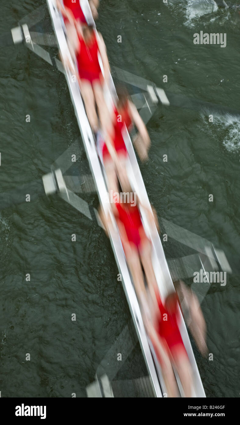 Blurred action overhead shot of an Oxford eight rowing on the Thames ...