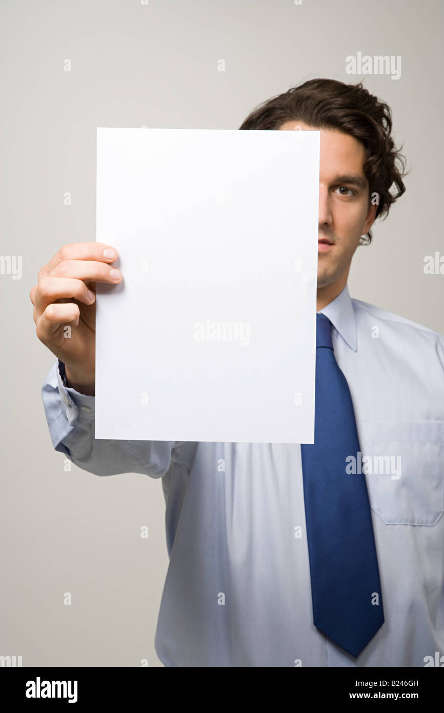 Portrait of a man holding a piece of paper Stock Photo - Alamy