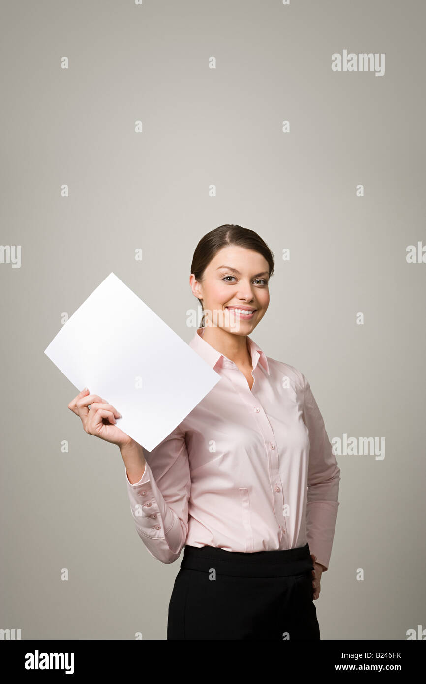 A woman holding a piece of paper Stock Photo - Alamy A woman holding a piece of paper Stock Photo - Alamy