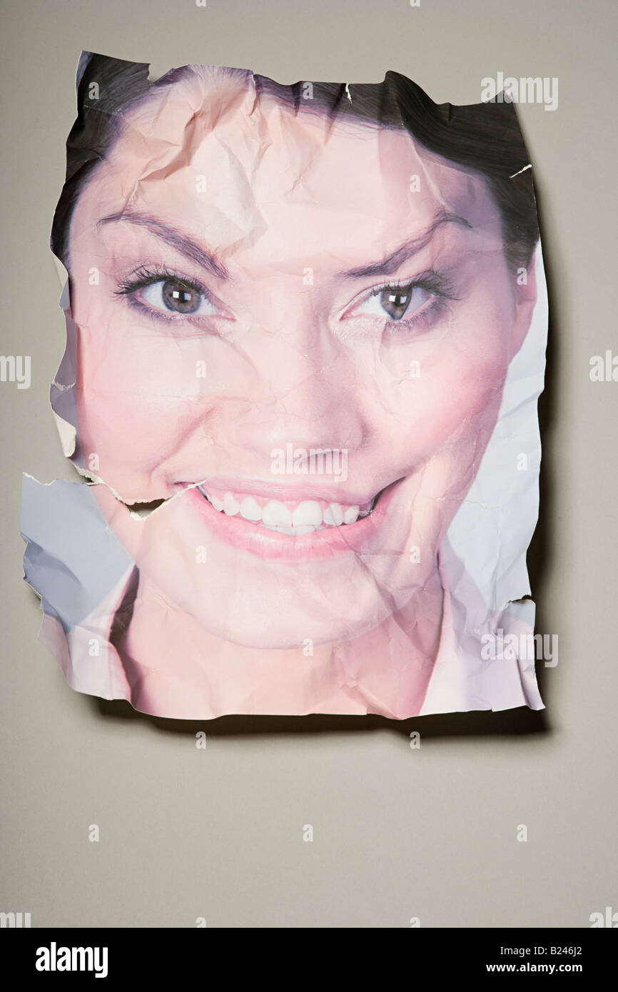 A crumpled photograph of a woman Stock Photo - Alamy