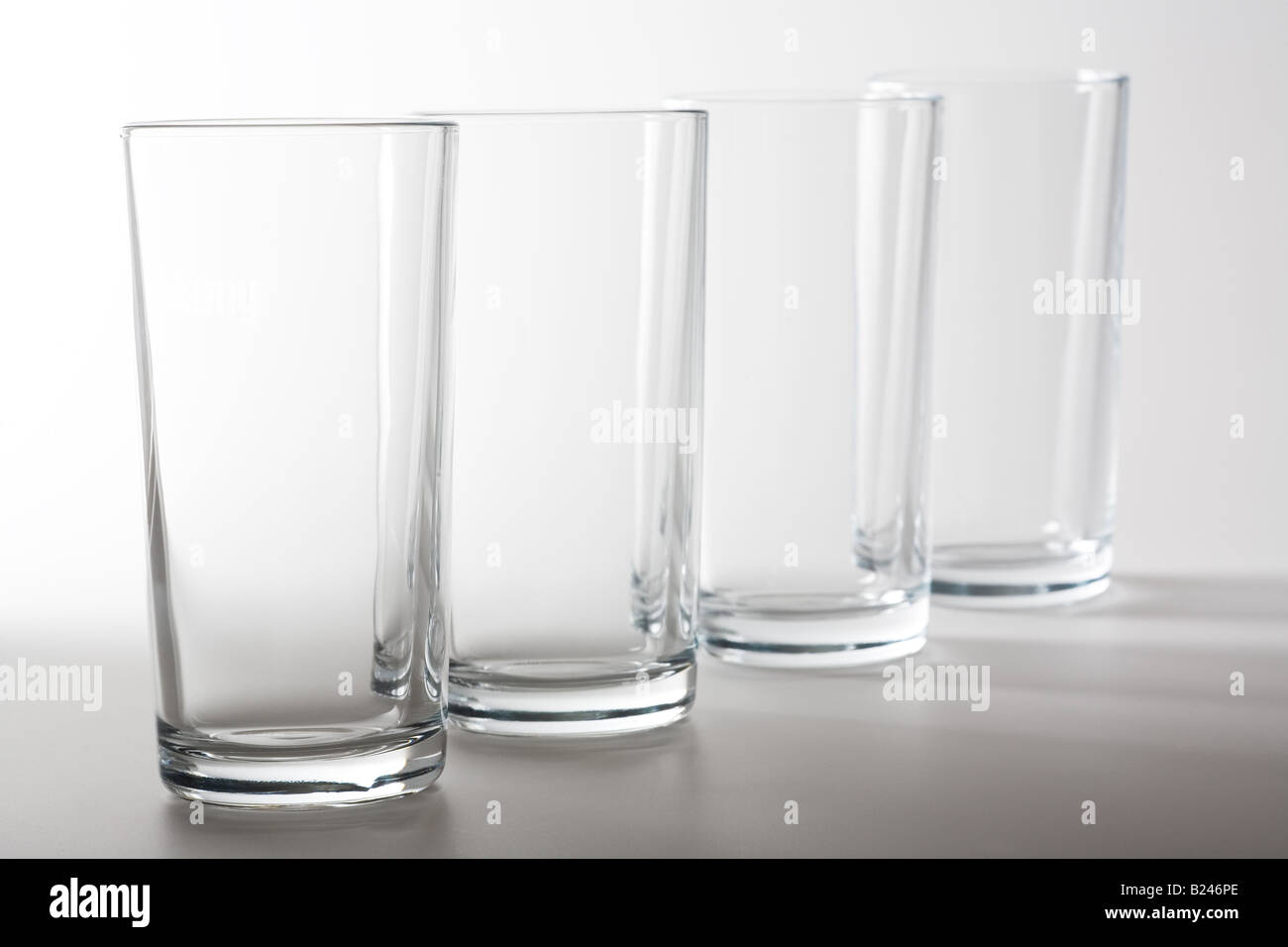 four glasses on white background Stock Photo - Alamy