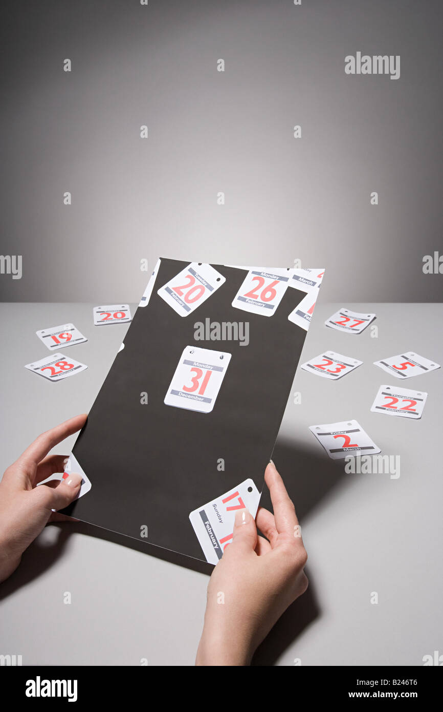 A person holding calendar dates Stock Photo - Alamy