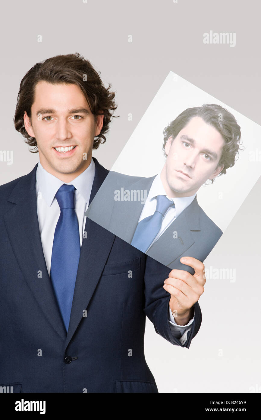 Portrait man holding photograph himself hi-res stock photography and ...