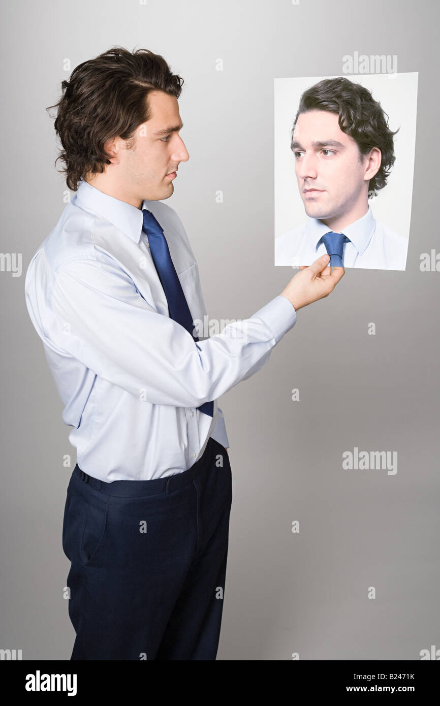 Portrait man holding photograph himself hi-res stock photography and ...