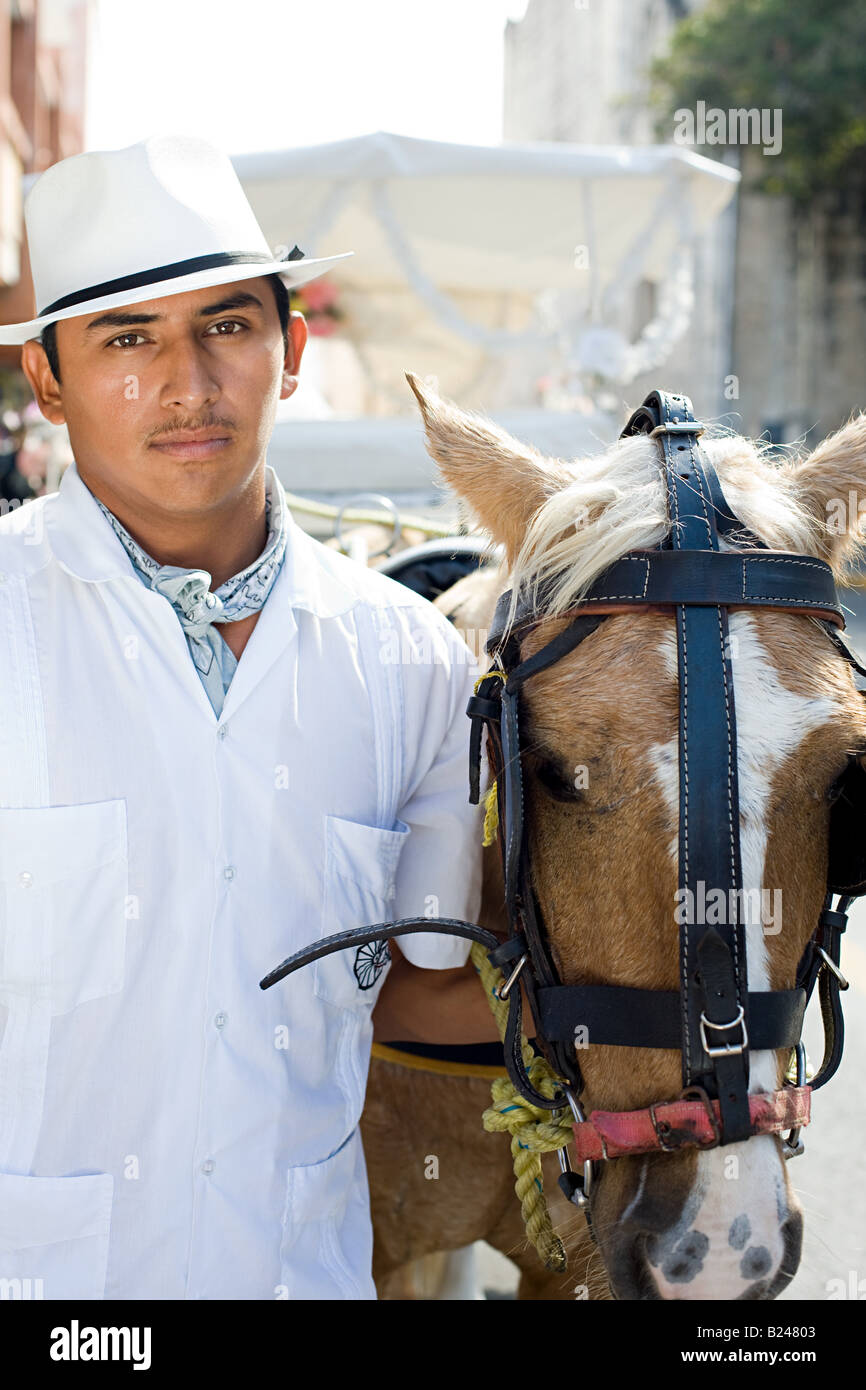Young man and horse Stock Photo - Alamy