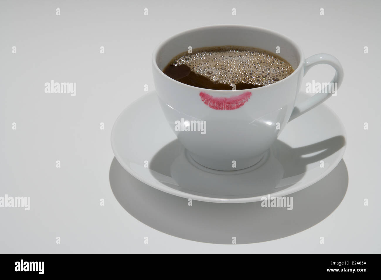 Lipstick on the edge of a coffee cup Stock Photo - Alamy
