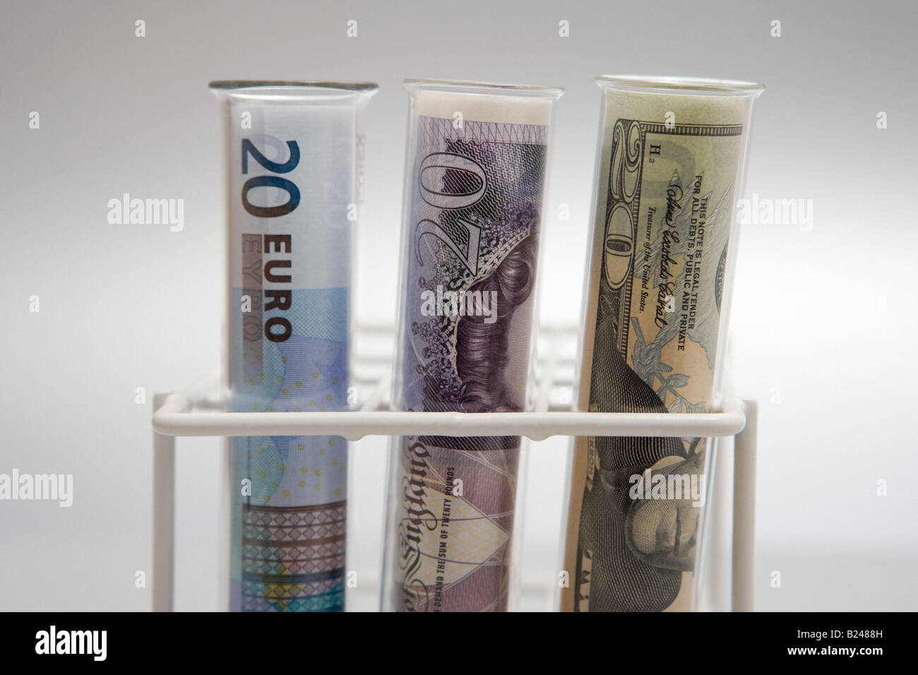 Three banknotes in test tubes Stock Photo - Alamy