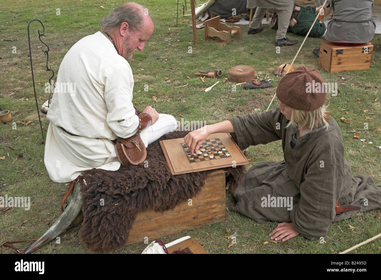 Ormsgard Anglo-Saxon re-enactors, Sutton Hoo, Suffolk, England. Man and ...