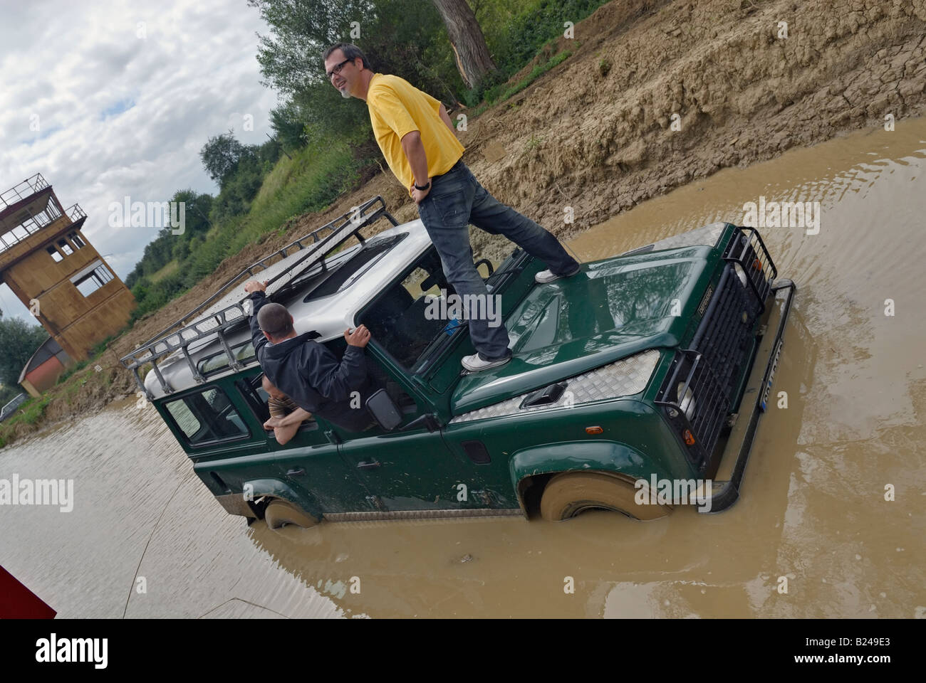 Standing on the bonnet and awaiting recovery for a Land Rover Defender ...