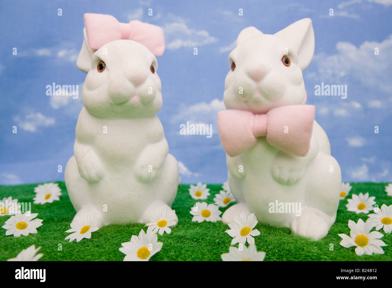 Two rabbits wearing bows Stock Photo - Alamy