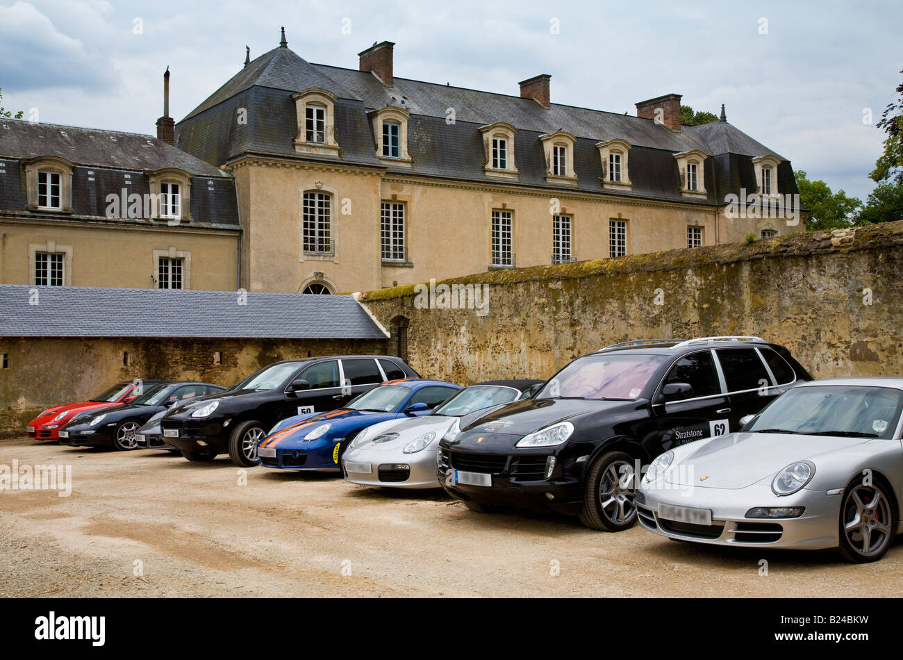 Porsche cars line up at the Chateau La Groirie country house in Trange ...