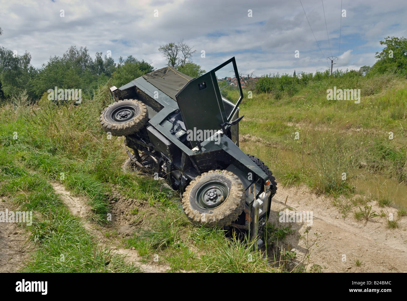 Land Rover Series 2a Lightweight on its side after it slipped off the ...