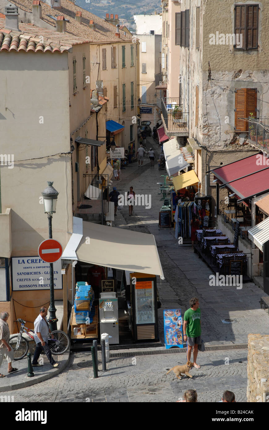 A main street of the north Corsican town of Calvi Stock Photo - Alamy