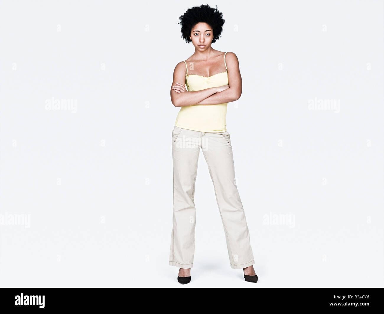Woman stands arms crossed in hi-res stock photography and images - Alamy