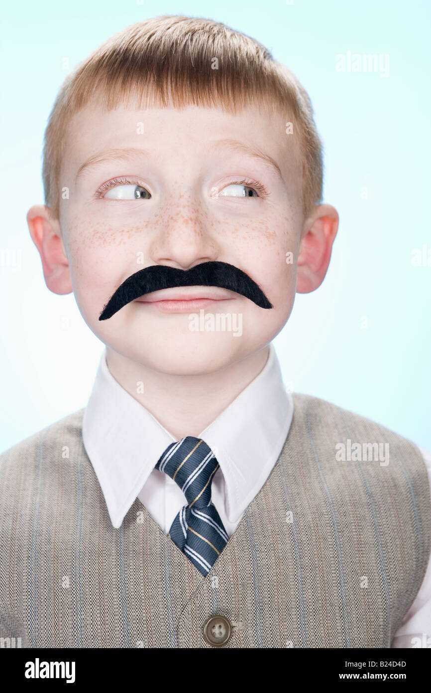 Portrait of a boy wearing a fake moustache Stock Photo - Alamy