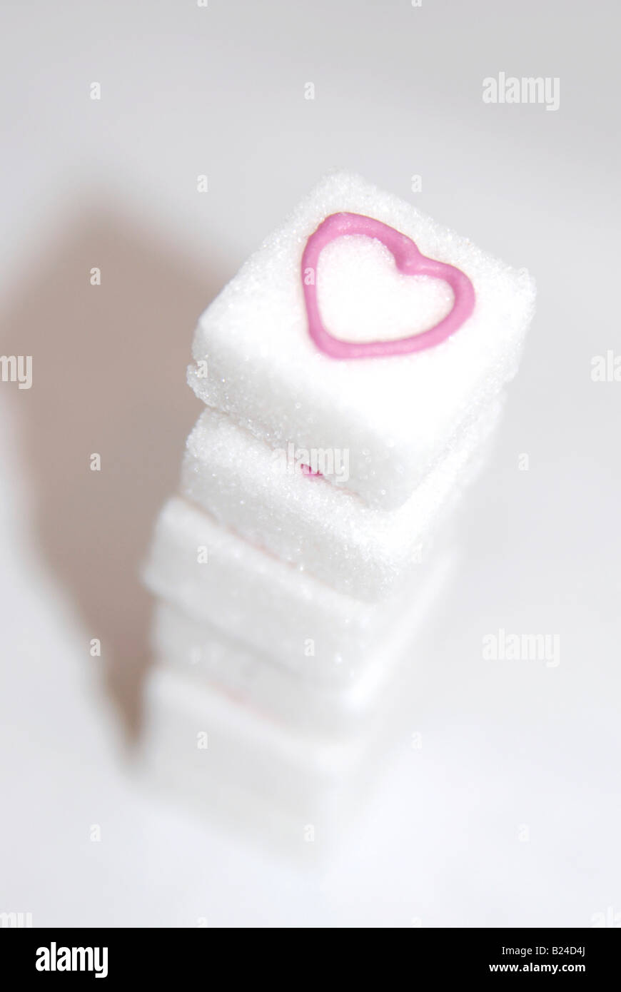 A stack of 6 sugar cubes, with iced pink hearts on, at a summer wedding ...