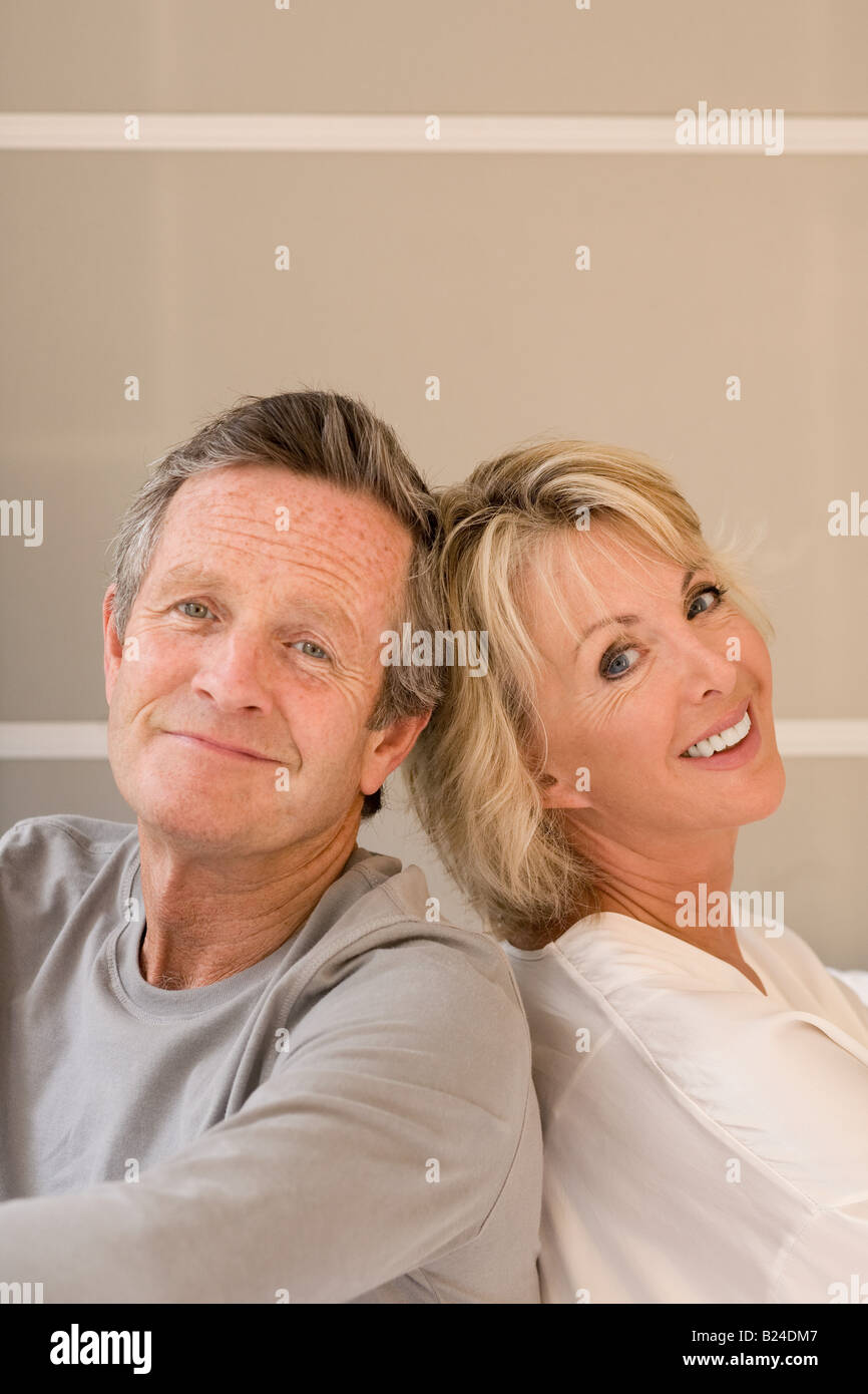 Couple back to back Stock Photo - Alamy