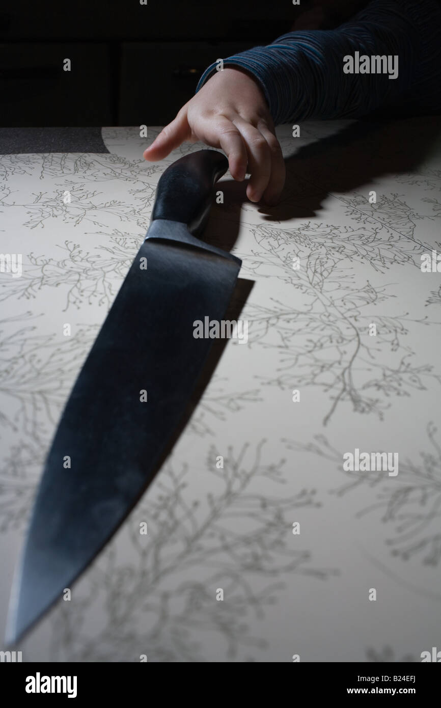 Child reaching for knife Stock Photo - Alamy Child reaching for knife Stock Photo - Alamy