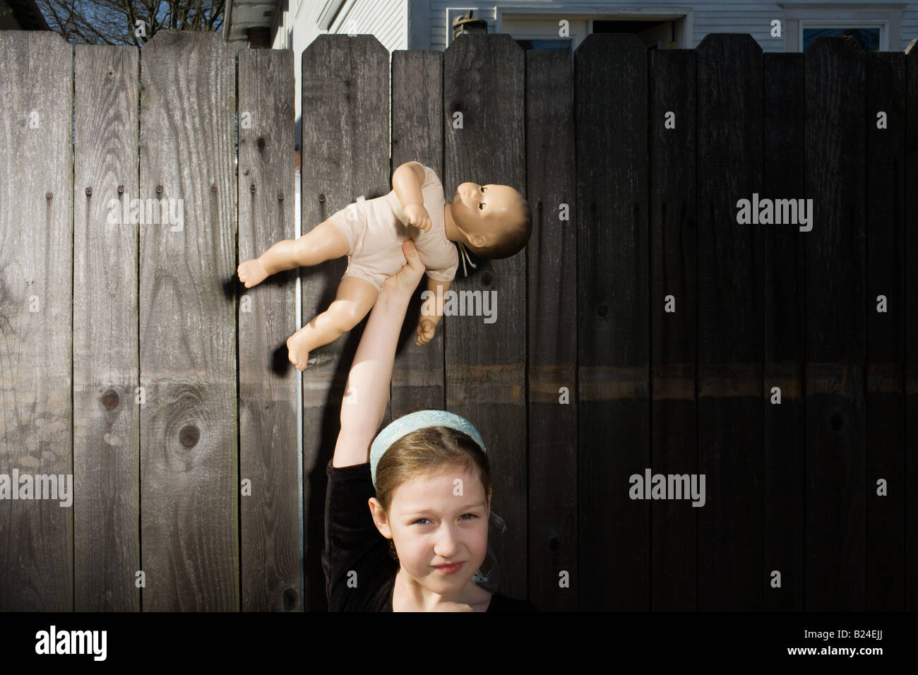 Girl with doll Stock Photo - Alamy
