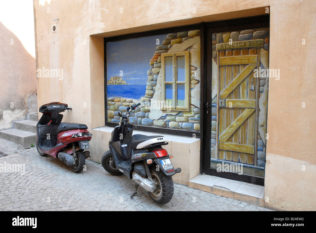 painted facade decorates closed down and disused back street shop ...