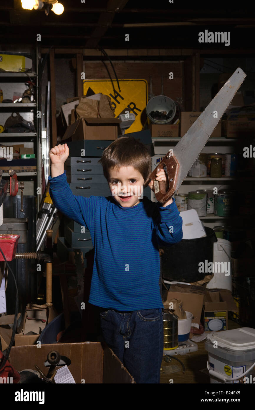 Child holding saw hi-res stock photography and images - Alamy