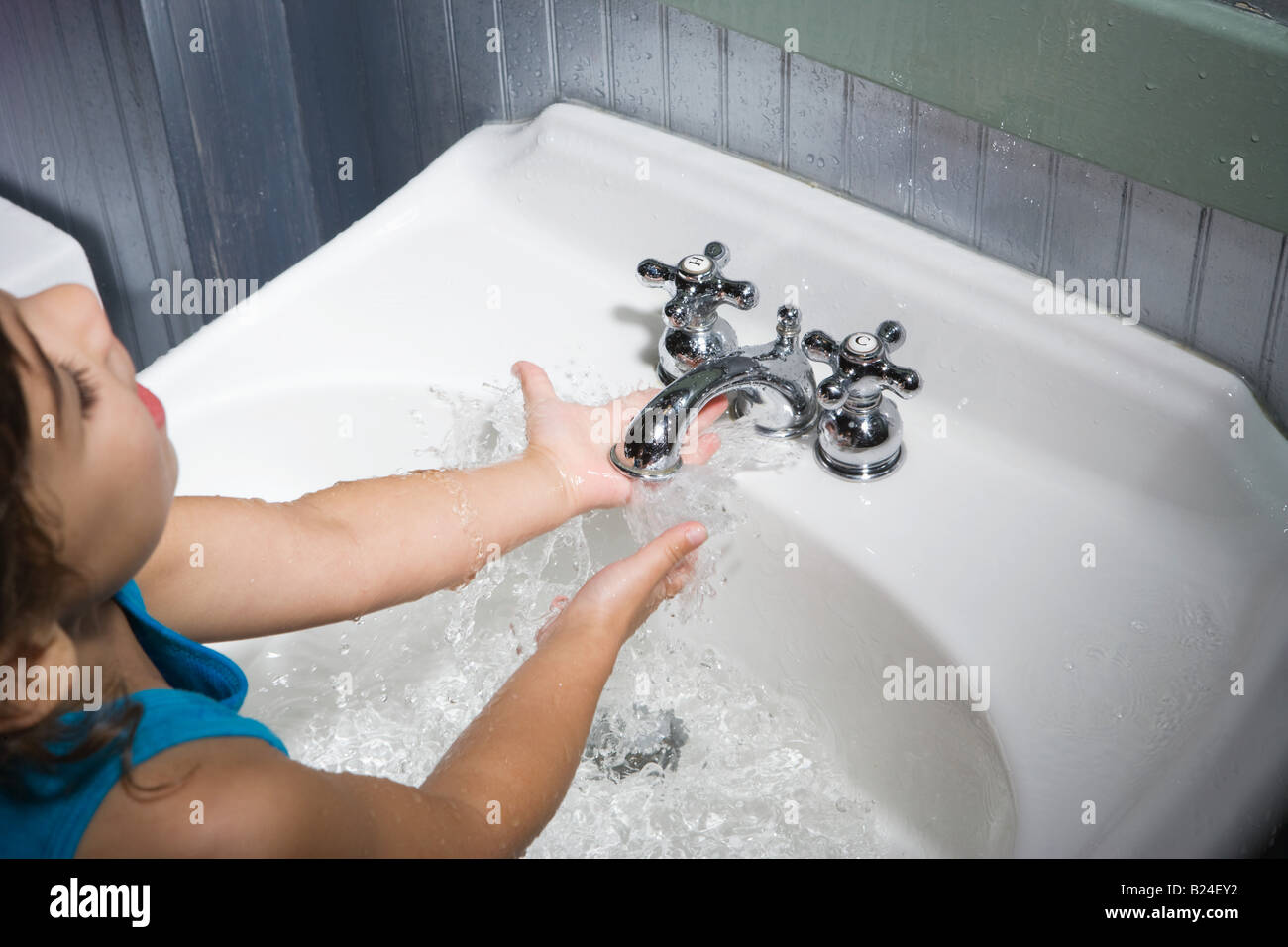 Girl splashing water Stock Photo - Alamy