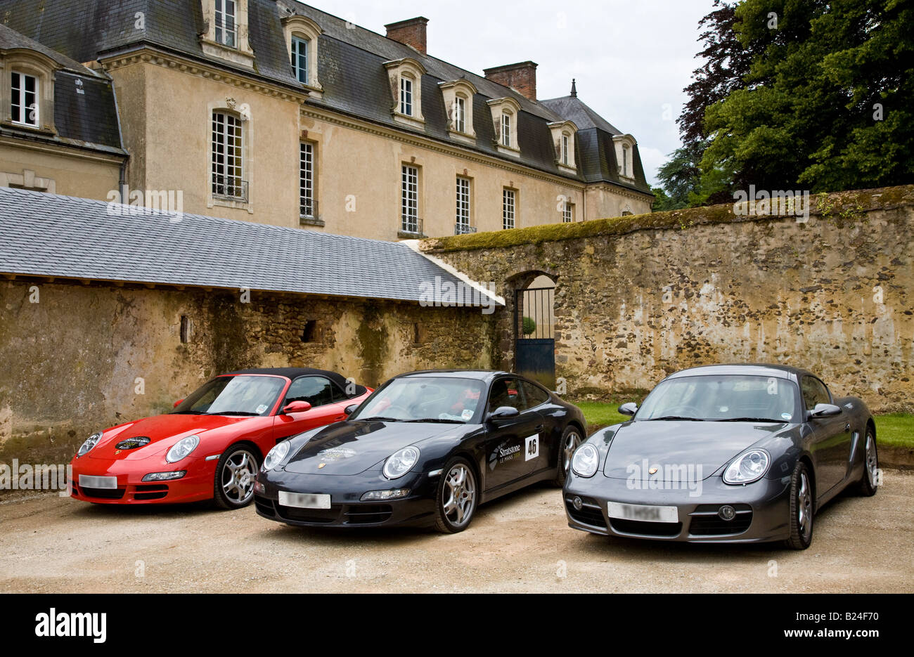 Porsche cars line up at the Chateau La Groirie country house in Trange ...