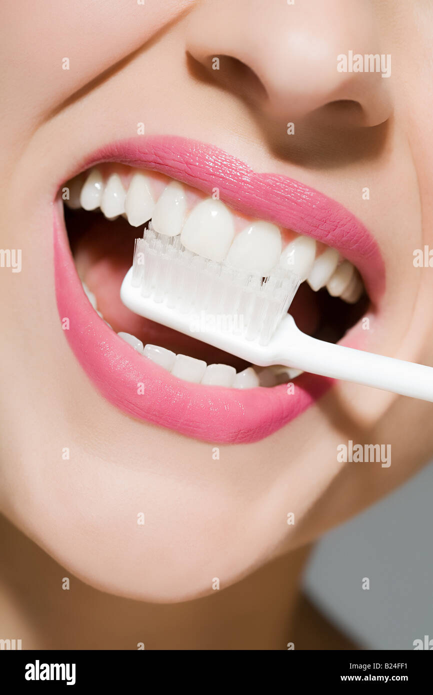 Woman brushing teeth Stock Photo - Alamy