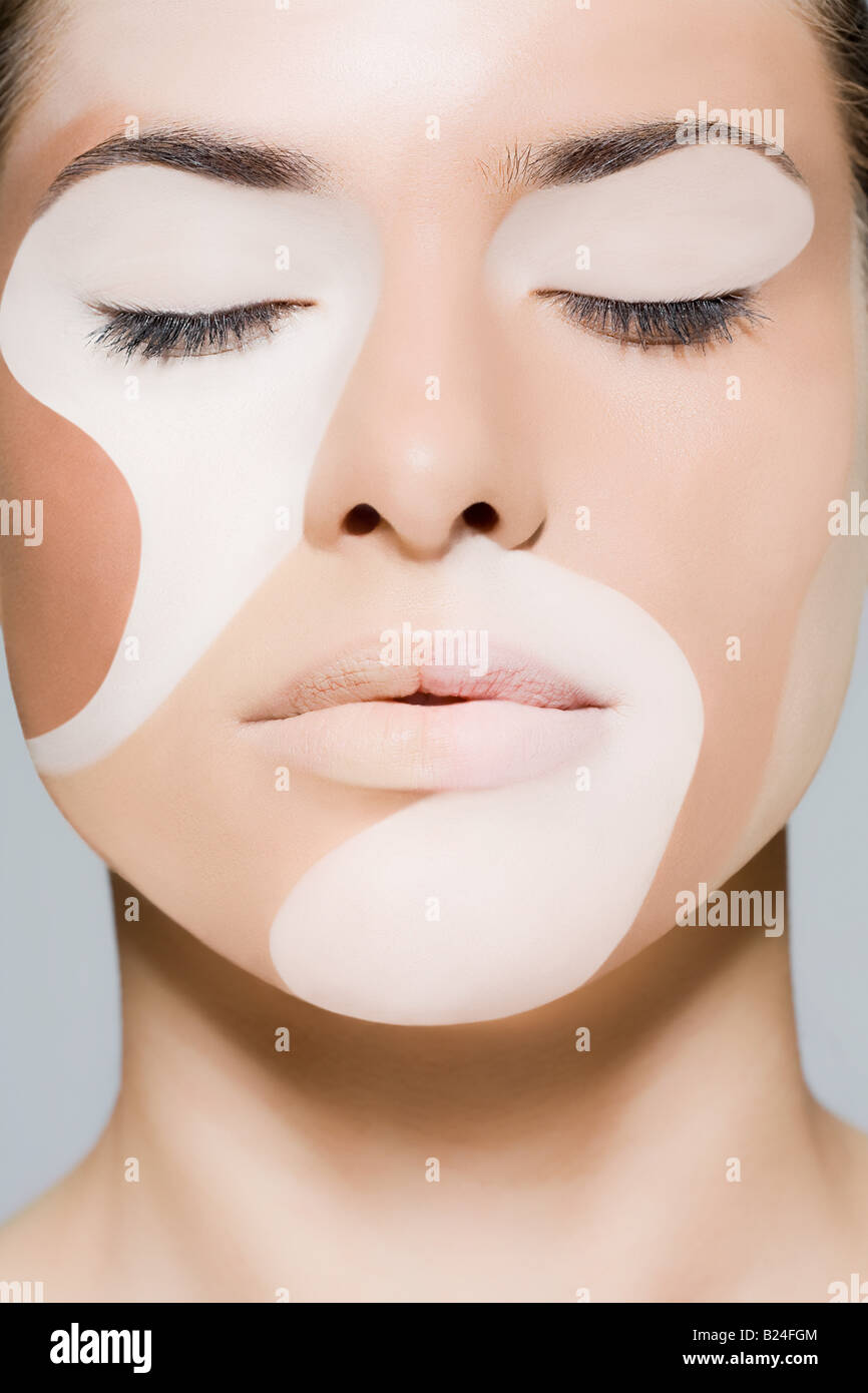 Woman with different colours on her face Stock Photo - Alamy