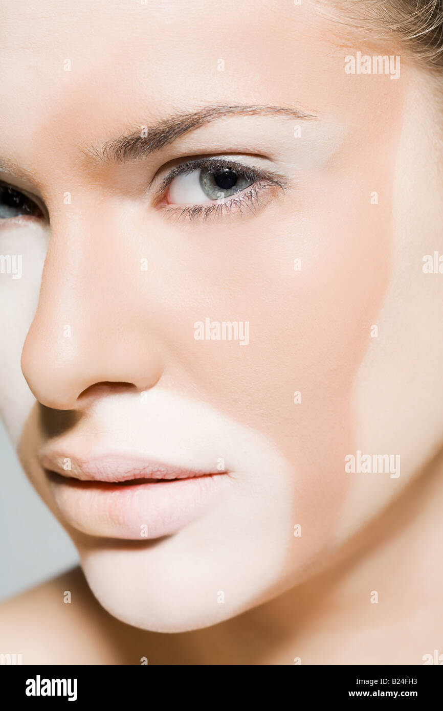 Woman with different colours on her face Stock Photo - Alamy