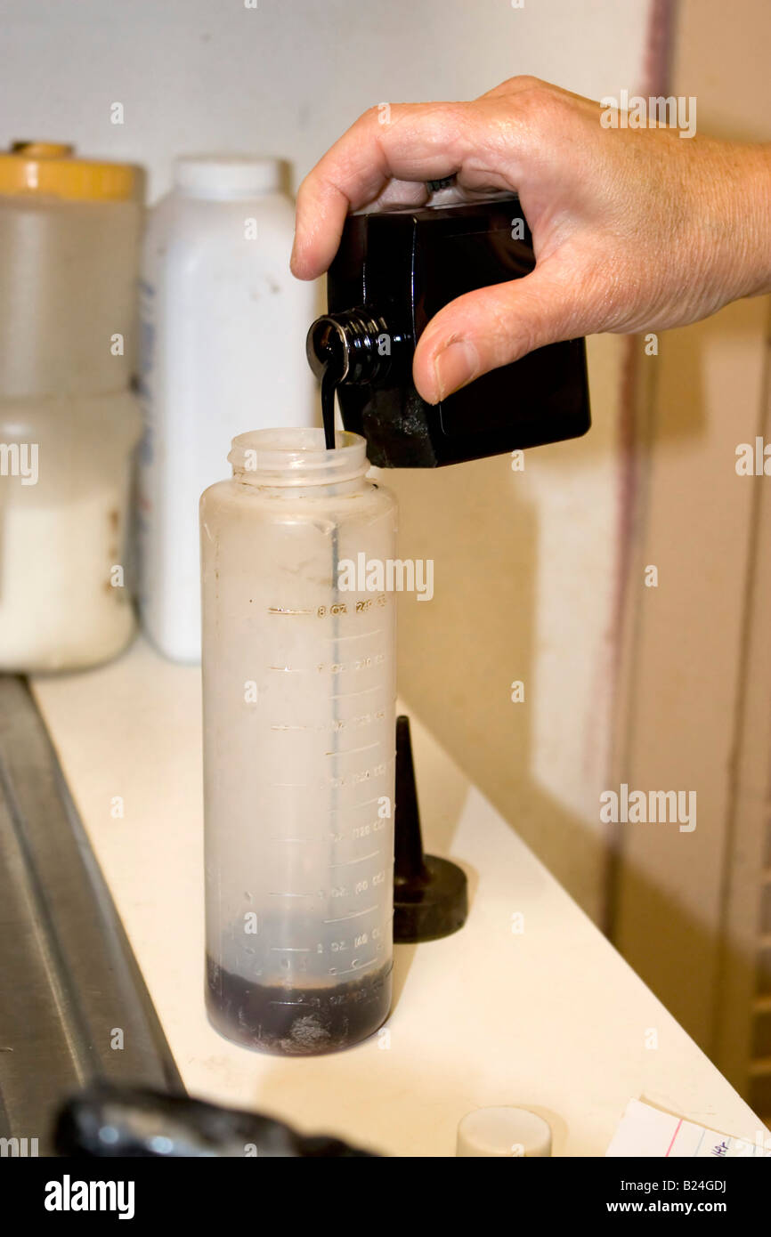 A hairdresser mixing a hair color formula very carefully Stock Photo ...