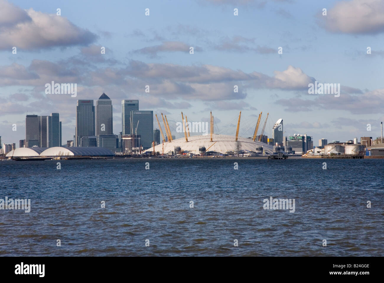 Millennium Dome O2 arena from the River Thames with Canary Wharf behind ...