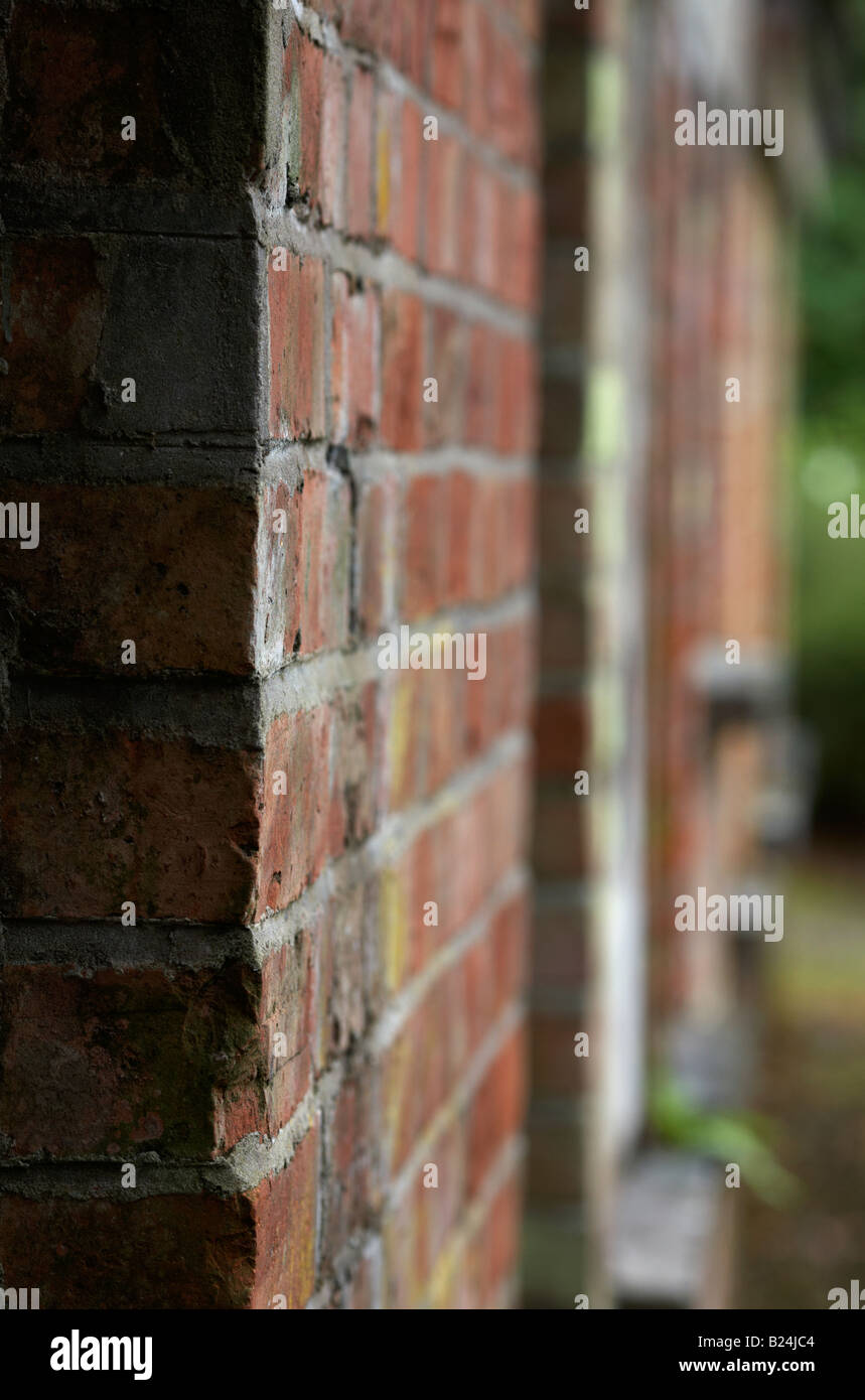 old weathered victorian red brick walls of an abandoned derelict ...