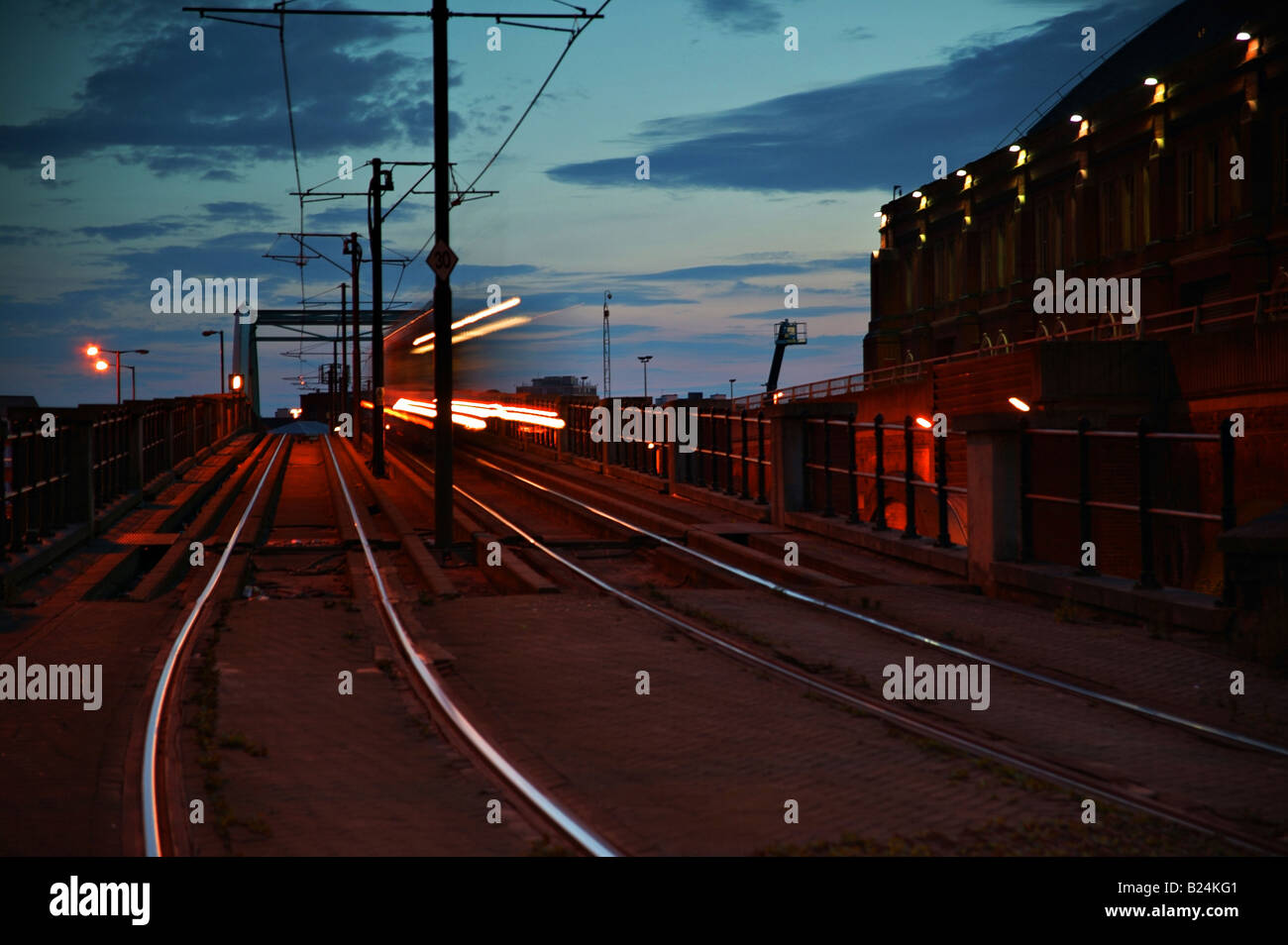 Tram at night Manchester UK Stock Photo - Alamy