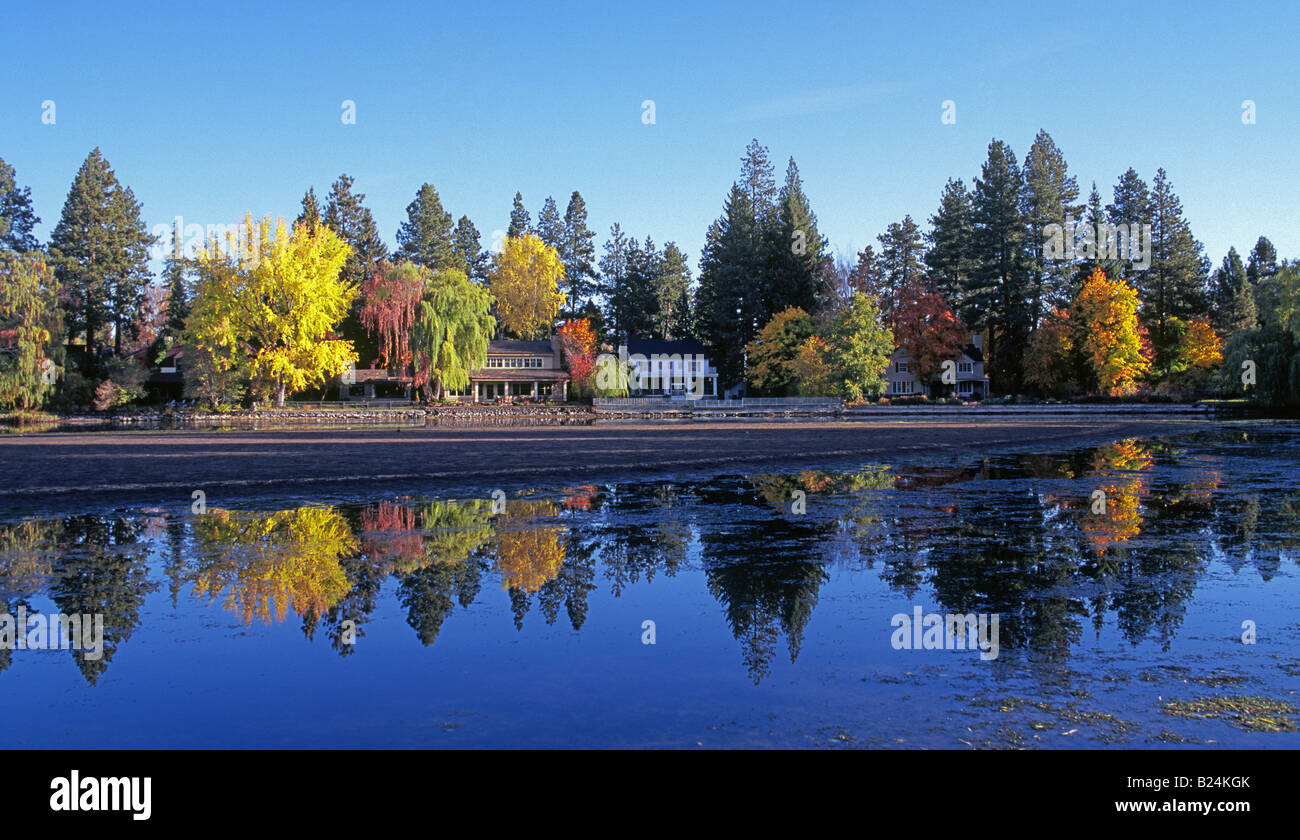 The reflection of riverside houses during the peak of the autumn color ...