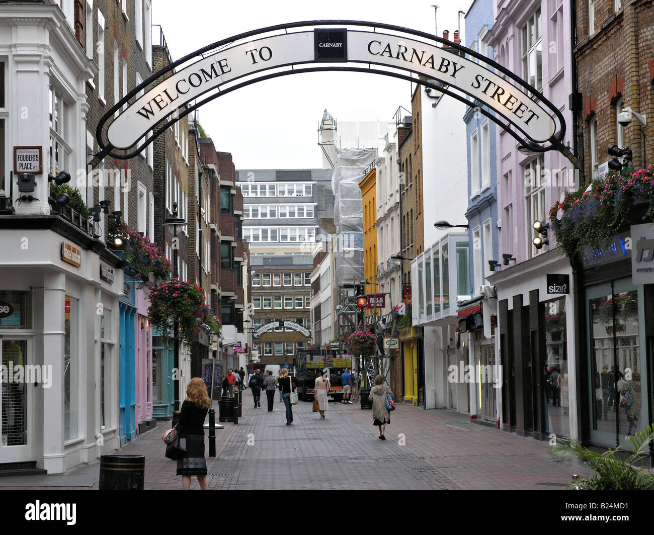 welcome to carnaby street swinging 60's london sign over street england ...