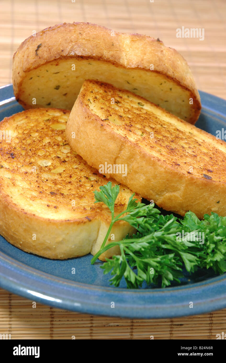 Three pieces of Texas toast on a small blue ceramic plate Stock Photo ...