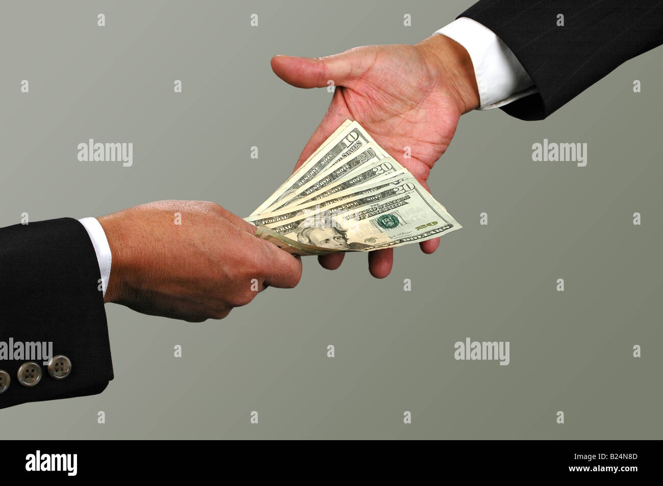 Money exchange between two businessmen Stock Photo - Alamy