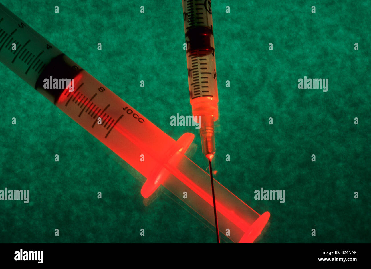 Two medical syringes needles hi-res stock photography and images - Alamy