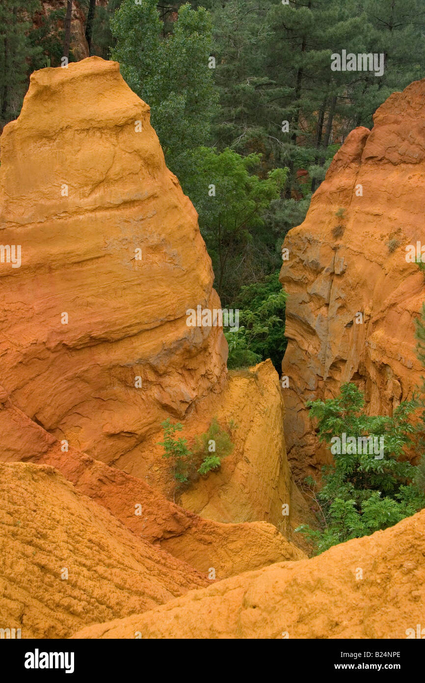 Ochre cliffs at Roussillon in the Luberon area of France, where raw ...