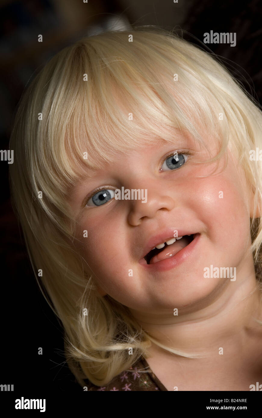 Stock photo of a portrait of a two year old child with blue eyes and ...