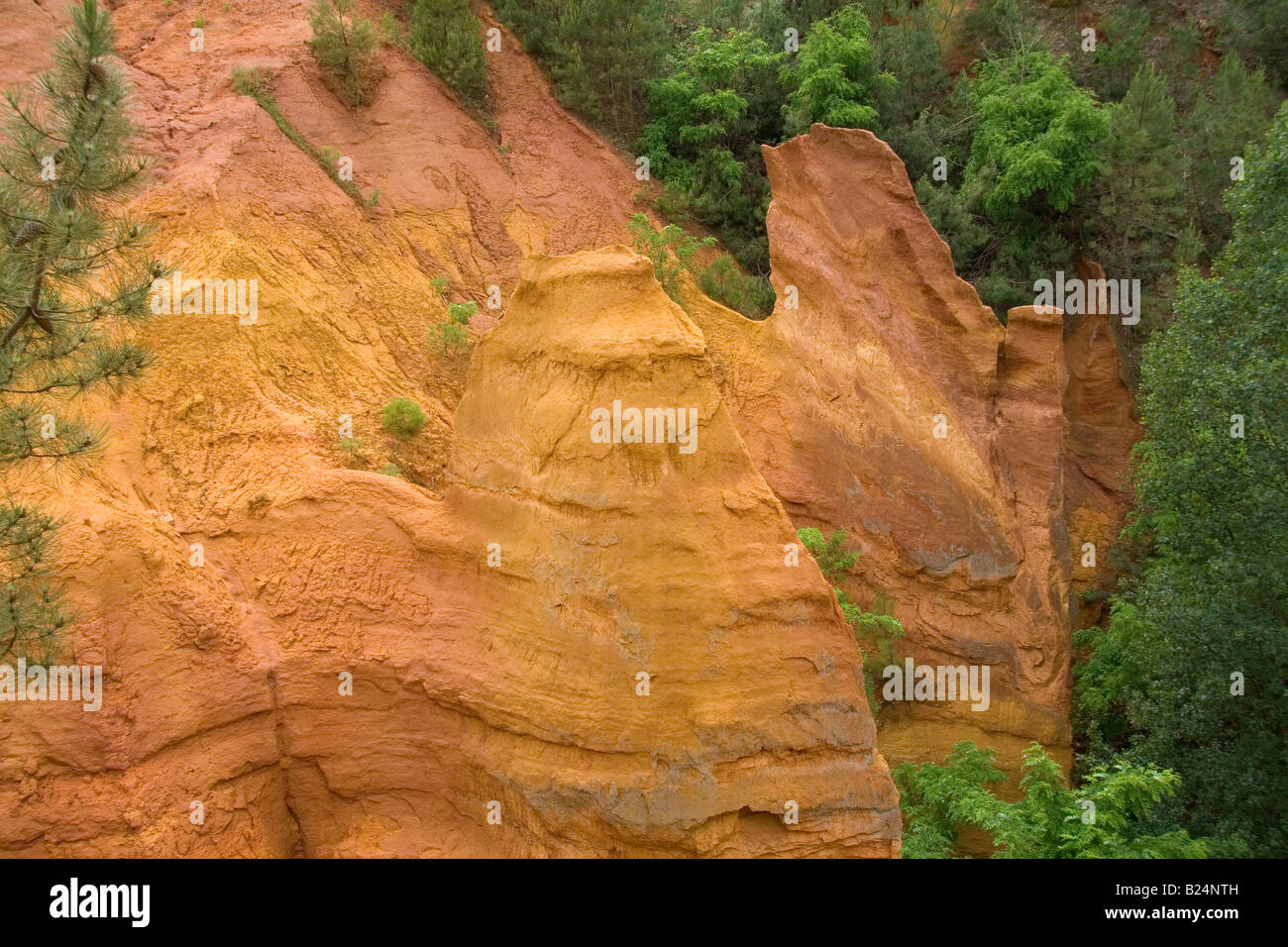 Ochre cliffs at Roussillon in the Luberon area of France, where raw ...