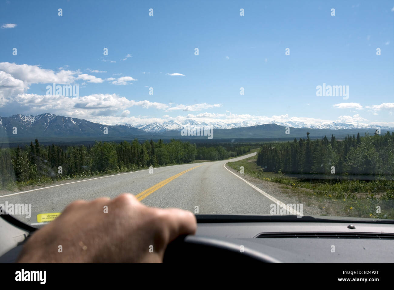 Driving a car, on the long road to freedom, Alaska Stock Photo - Alamy