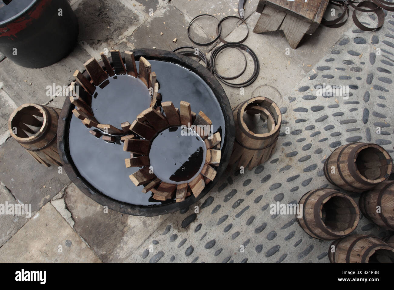 Different stages in the process of making barrels to contain Madeira ...